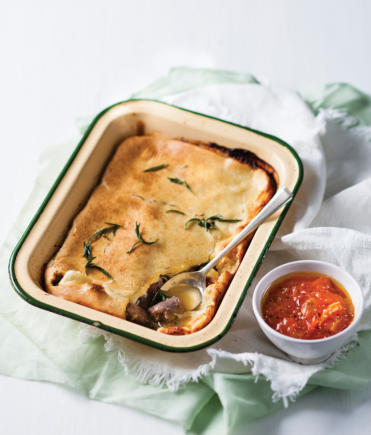 Lamb boerewors baked in batter with chilli spiked tomato and onion ...