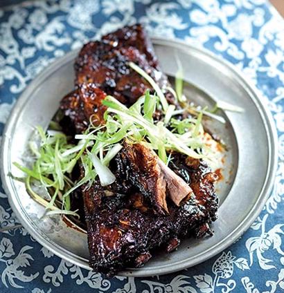 Asian treacle-sugar ribs with spring onion curls | Woolworths TASTE