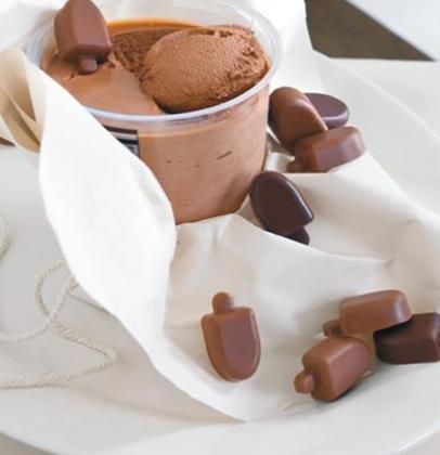 Frozen classic chocolate mousse with little chocolate lollies ...