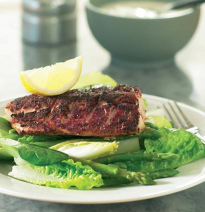 Grilled sumac-dusted fish on a big green salad | Woolworths TASTE