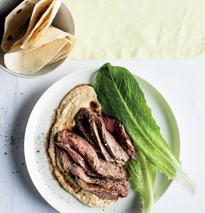 Roast Middle-Eastern-spiced lamb on hummus | Woolworths TASTE