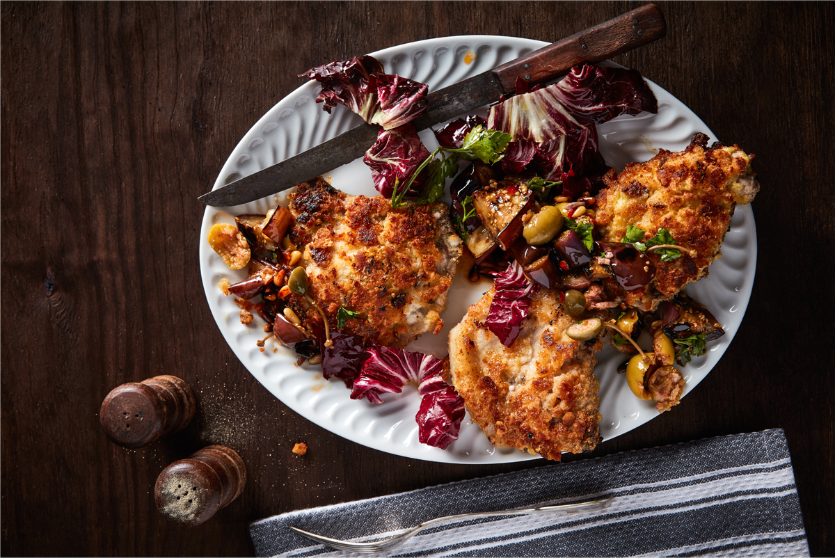 Parmesan-crumbed pork chops with caponata | Woolworths TASTE