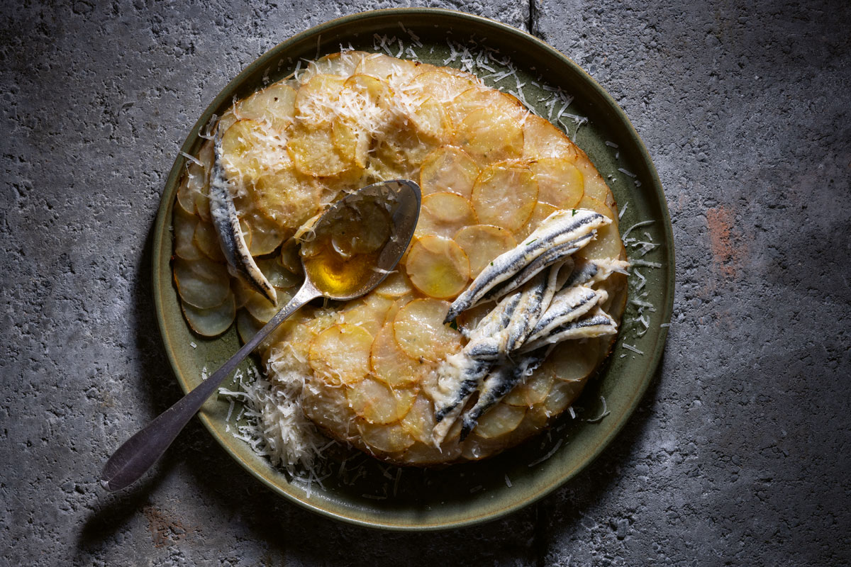 Pommes Anna with anchovies and parmesan recipe | Woolworths TASTE