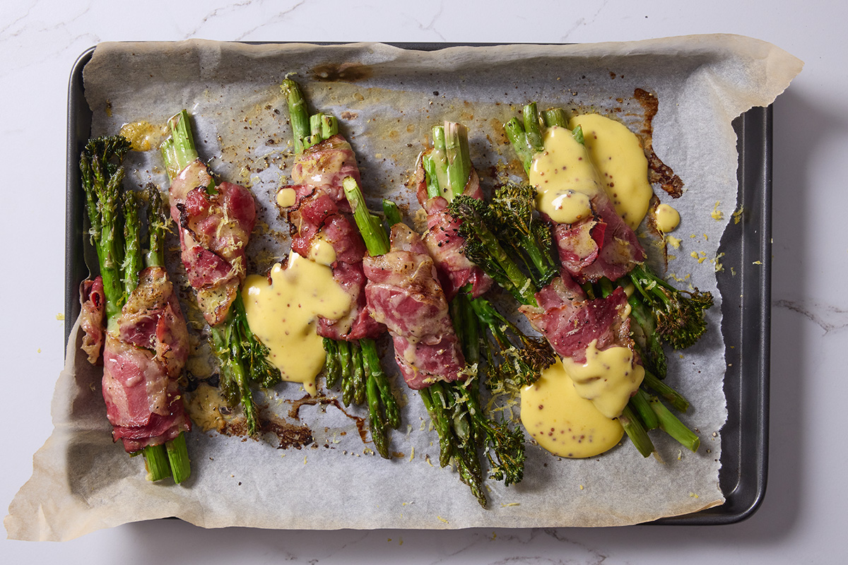 Beef rasher-wrapped greens with Hollandaise | Woolworths TASTE