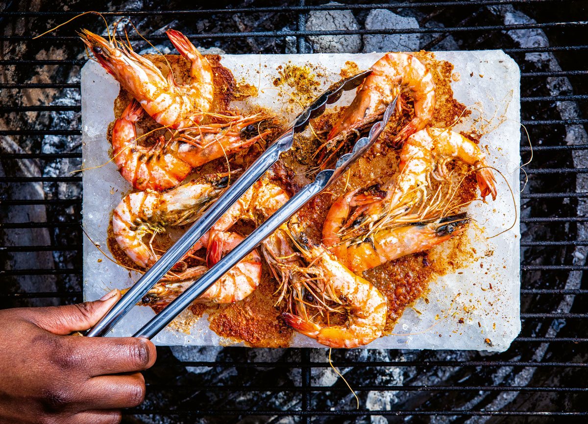 Cajun prawns on a salt slab recipe | Woolworths TASTE