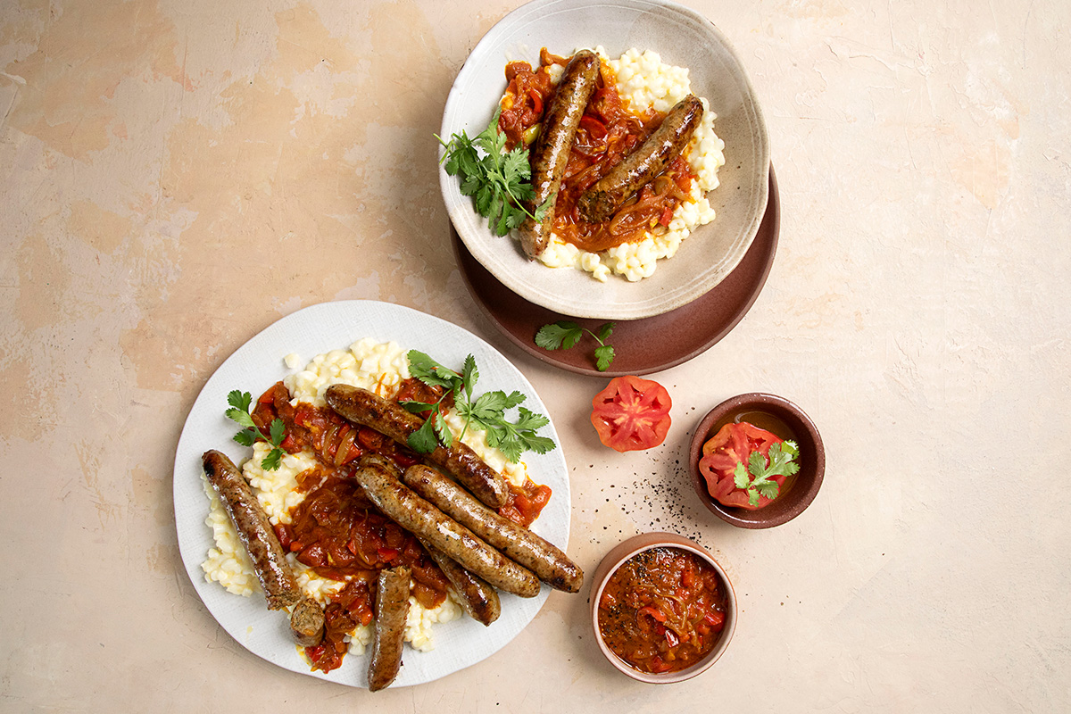 Sosatie spiced lamb sausage with creamy samp | Woolworths TASTE